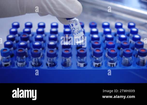 The scientist took out a small test tube with liquid from a laboratory ...