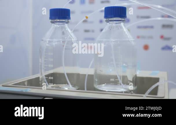 glass flask in the laboratory. Medical laboratory experiments. Taking ...