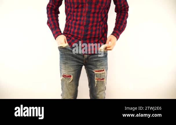 Man showing his empty pockets, turning his pockets inside out. Portrait ...
