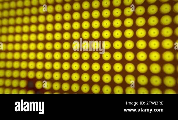 Emoticon smile face on big LED display with large pixels. Bright light happy expression icon on ...