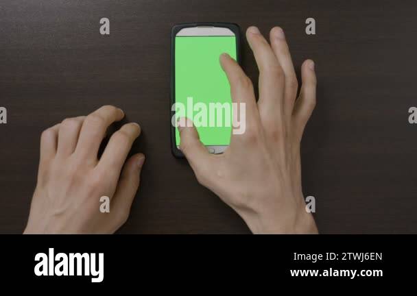 Male Fingers Making Gestures Touching And Swiping The Green Screen Of