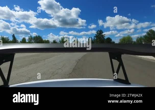 Spoiler on moving race car, automotive aerodynamic device, modified ...