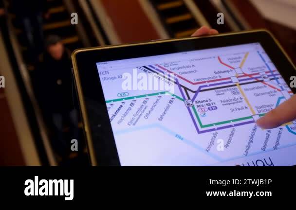 Man in underground examines the subway map using the tablet Stock Video ...