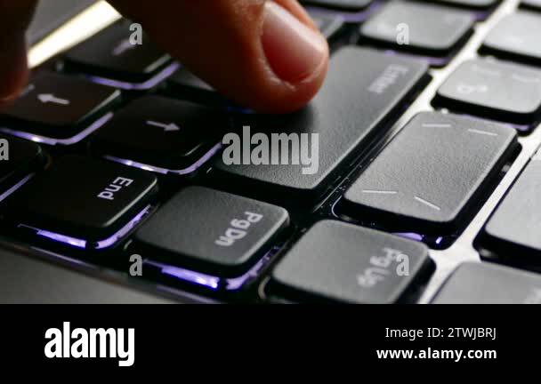 Press the buttons on the laptop keyboard. Work on computer. Type text ...