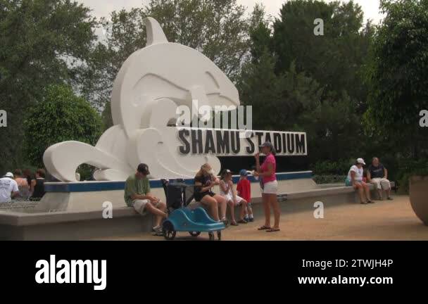 People Walking Past and Standing at the Entrance to the Shamu Stadium ...