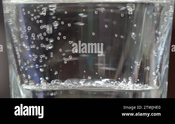 clean sparkling water in a transparent glass beaker close up Stock ...
