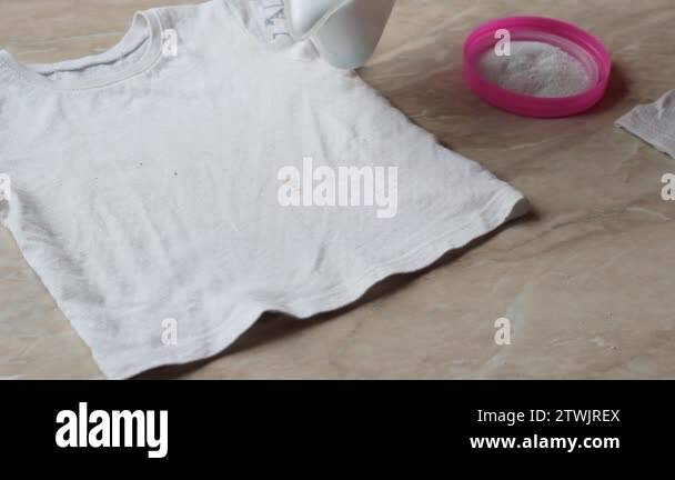 Mother to clean stains on childrens clothes from candies with the help ...