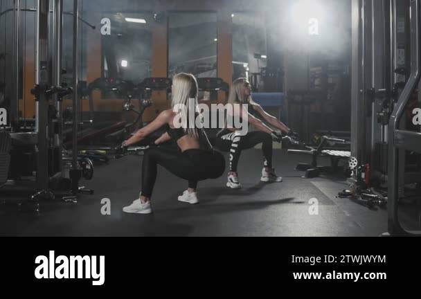 Fitness woman squat for strengthening legs and buttocks. Blonde squat ...