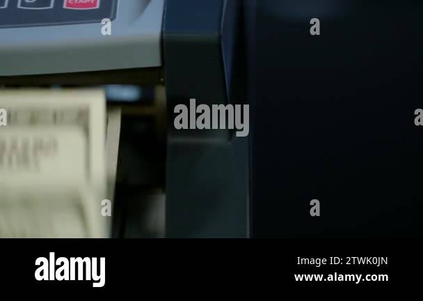 Counting us dollars banknotes on currency counter machine. Counting ...