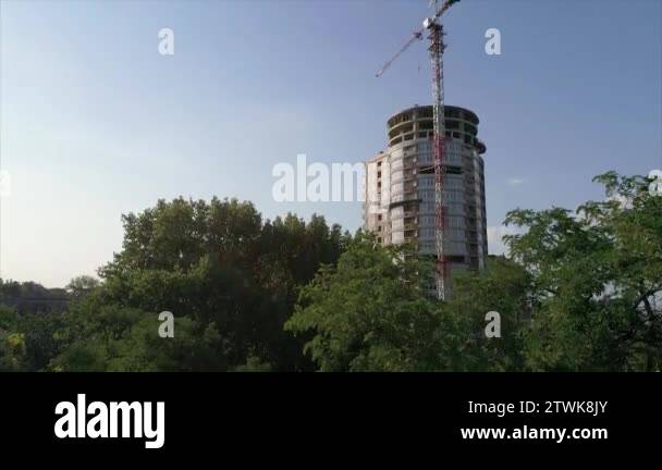 Construction of a multi-storey high house, a tower crane at a ...