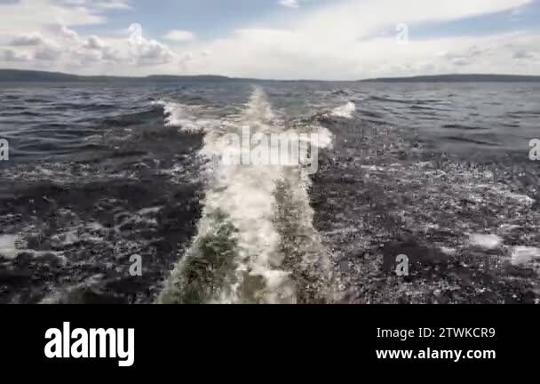 Movement by boat on the sea. Shooting from the stern. You can see the ...