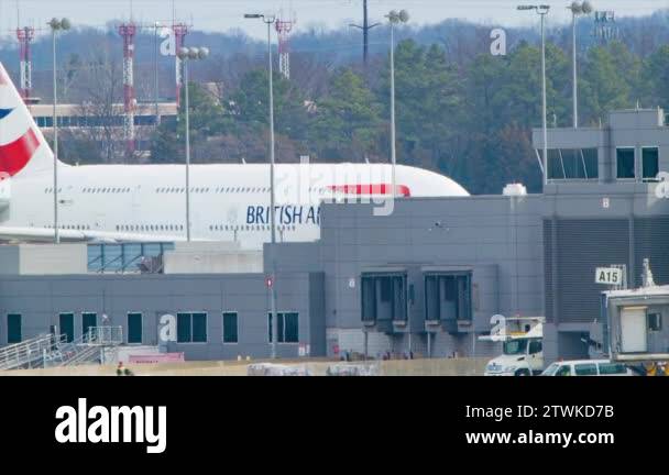 British Airways Airbus A380 Jet Airliner Taxiing Behind a Terminal ...