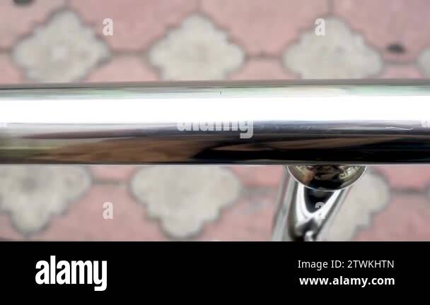 Stainless chrome steel railing on the open porch , close-up . Chrome ...