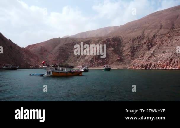 Ship travel sails along Musandam peninsula, Sultanate of Oman, Gulf of ...
