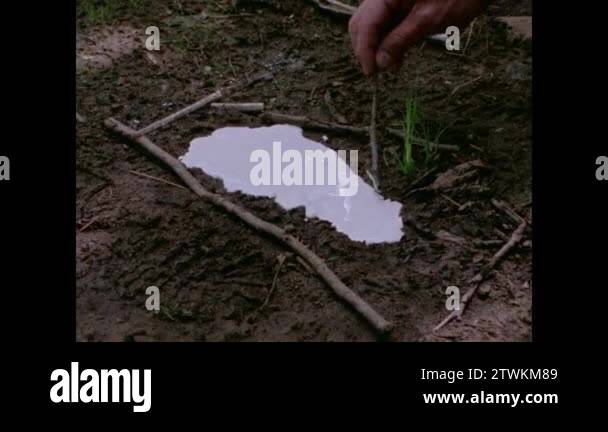 Man plaster casting a footprint on the ground, 1970s Stock Video ...