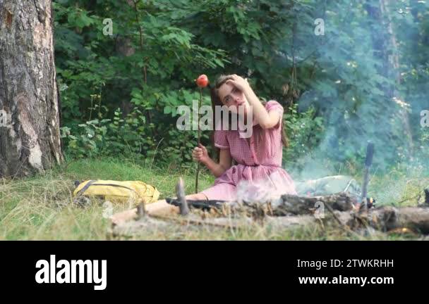 Two young women in pin up style having fun at a picnic in the park in ...