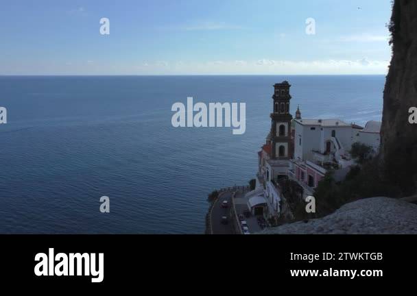 Stunning Amalfi coast scenery from high up. Cars driving on cliff edge ...