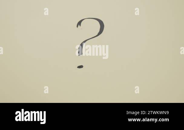 Top view of girl hands drawing plenty of question marks using red and ...