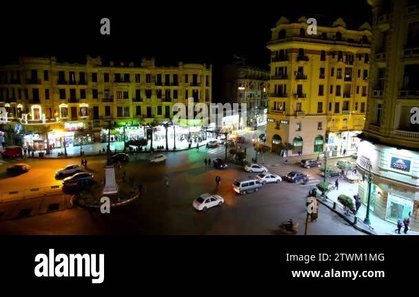 CAIRO, EGYPT - DECEMBER 23, 2017: The fast paced life of Talaat Harb Square with bright stores ...