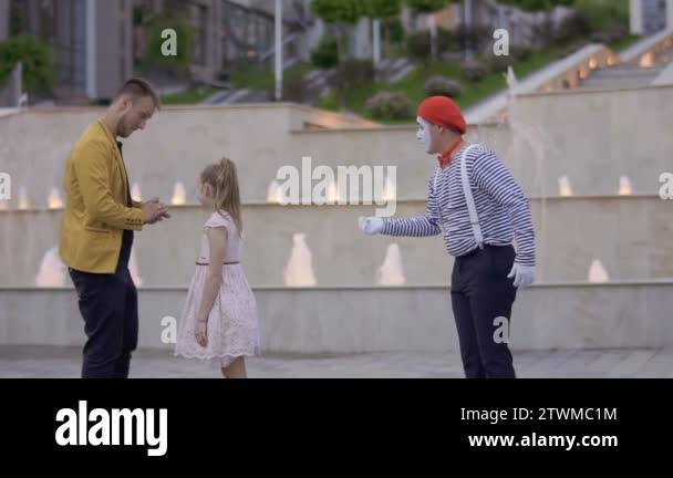 Mime and magician fighting for the girls attention showing her their ...