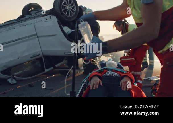 On the Car Crash Traffic Accident Scene: Paramedics Save Life of a ...