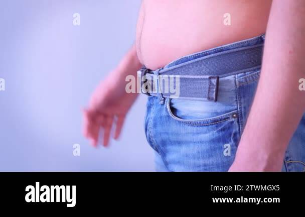 Man touches his flabby fat naked stomach, side view Stock Video Footage ...