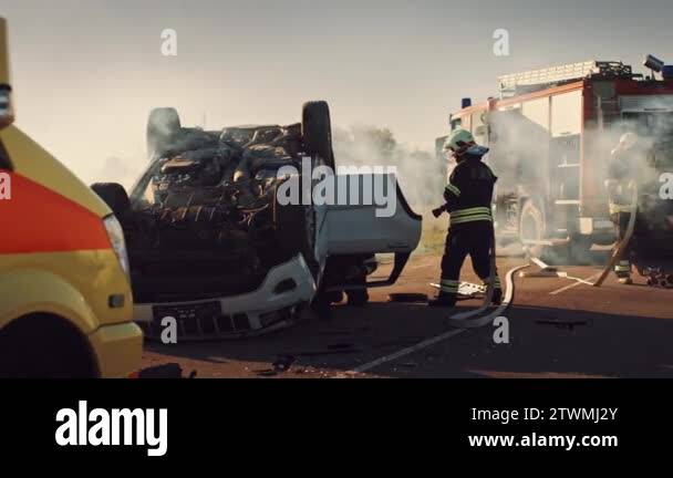 Rescue Team of Firefighters Arrive on the Car Crash Traffic Accident ...