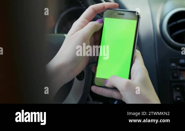 Girl Driver closeup, greenscreen in the car, urban city background ...