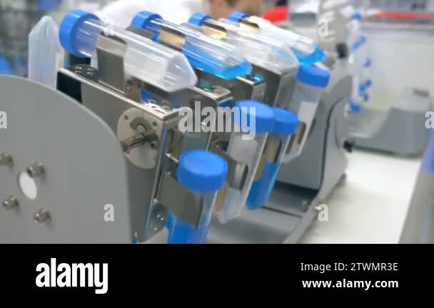 modern medical laboratory. Medical staff working with automatic machine ...