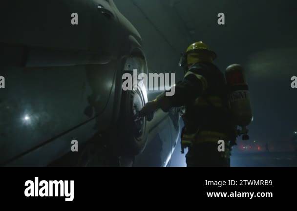 Car accident scene inside a tunnel, firefighters rescuing people from ...