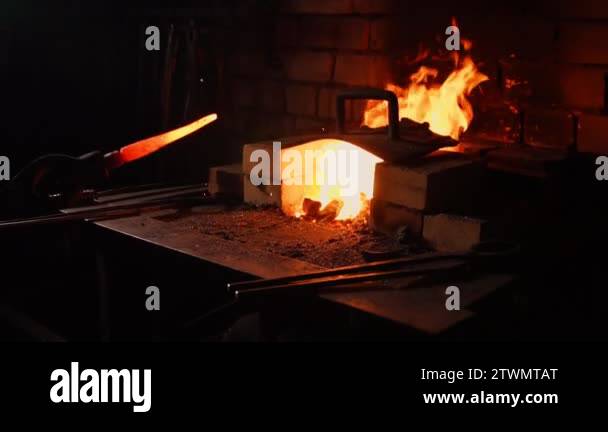 Hardening of the metal by sharp cooling in water. There is steam. The ...