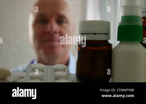 Man Smiling Open Medicine Closet Looking for Pills and Tablets (Ultra ...
