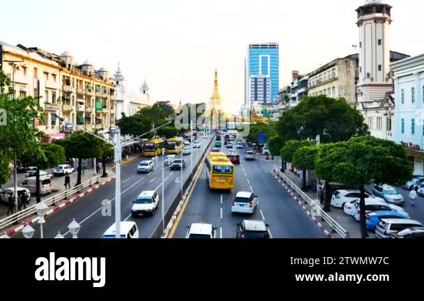 Streets of downtown Yangon on the road to Sule Pagoda timelapse with ...