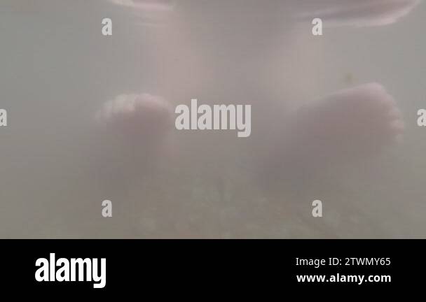shooting underwater, feet moving in muddy water Stock Video Footage - Alamy