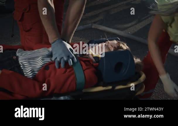 On the Car Crash Traffic Accident Scene: Paramedics Saving Life of a ...