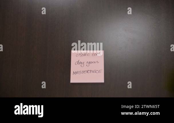 Top view of female hands sticking handwritten post it notes that ...