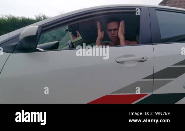 Angry car driver making aggressive gestures, non verbal communication ...