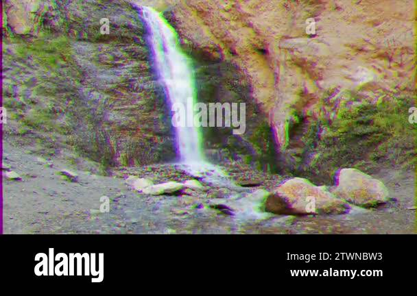 Glitch effect. The first waterfall in the valley of the Issyk-Ata ...