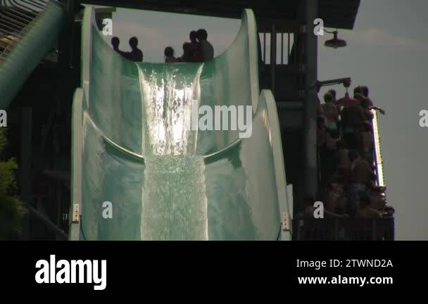 Two Unrecognizable Women Plunging Down a Fast Water Slide while Sitting ...