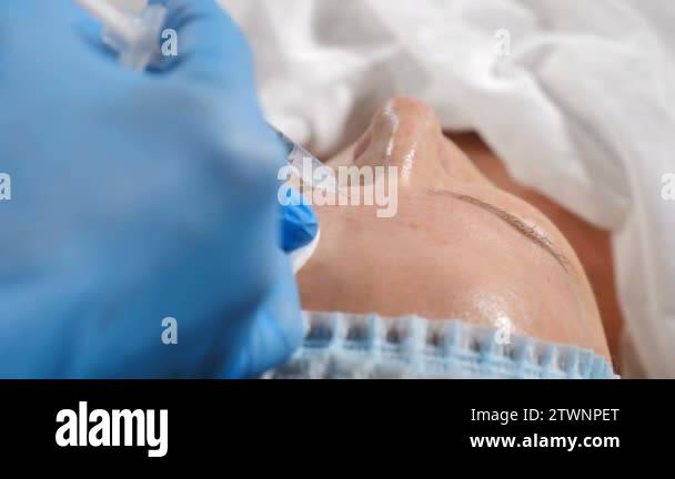 Modern beauty concept. Doctor view on young woman getting face ...