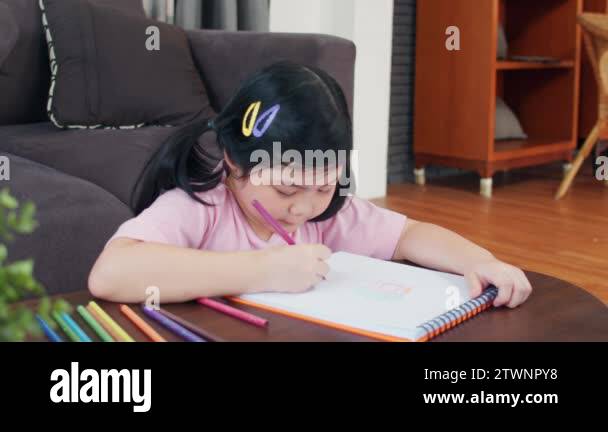 Young Asian girl drawing at home. Asia japanese woman child kid relax ...