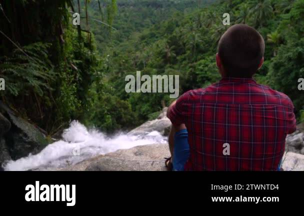 Man sitting on top waterfall Stock Videos & Footage - HD and 4K Video ...