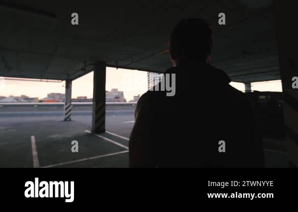 Rapper man walking in urban place city parking, back view Stock Video ...