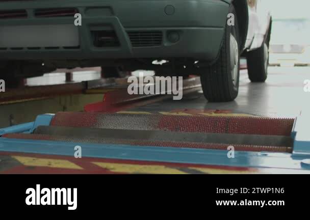 Checking the brake system of the car using the rollers at the service ...