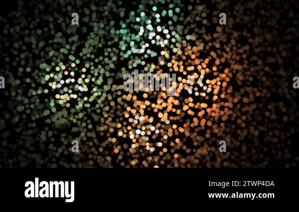 Abstract animation of small colorful particles chaotically moving on ...