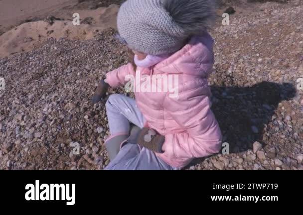 Girl throwing stones Stock Videos & Footage - HD and 4K Video Clips - Alamy