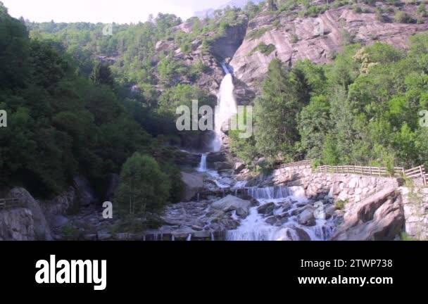 The particular waterfall of Noasca in Piedmont/ Italy is located behind ...