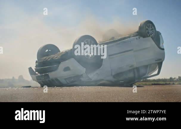 Horrific Traffic Accident Rollover Smoking and Burning Vehicle Lying on ...