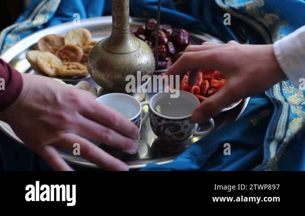 Muslim family. Iftar break fast spread consists of water, dates, dried ...