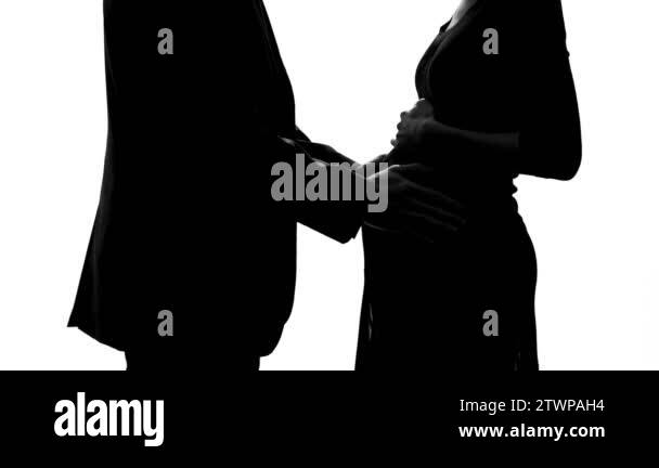 Pregnant woman shadow and loving husband touching her belly, family ...